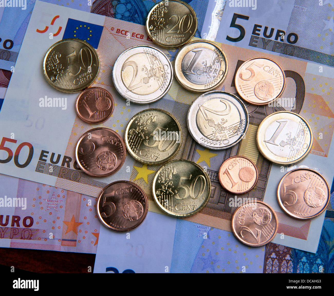 Euro banknotes and coins Stock Photo - Alamy