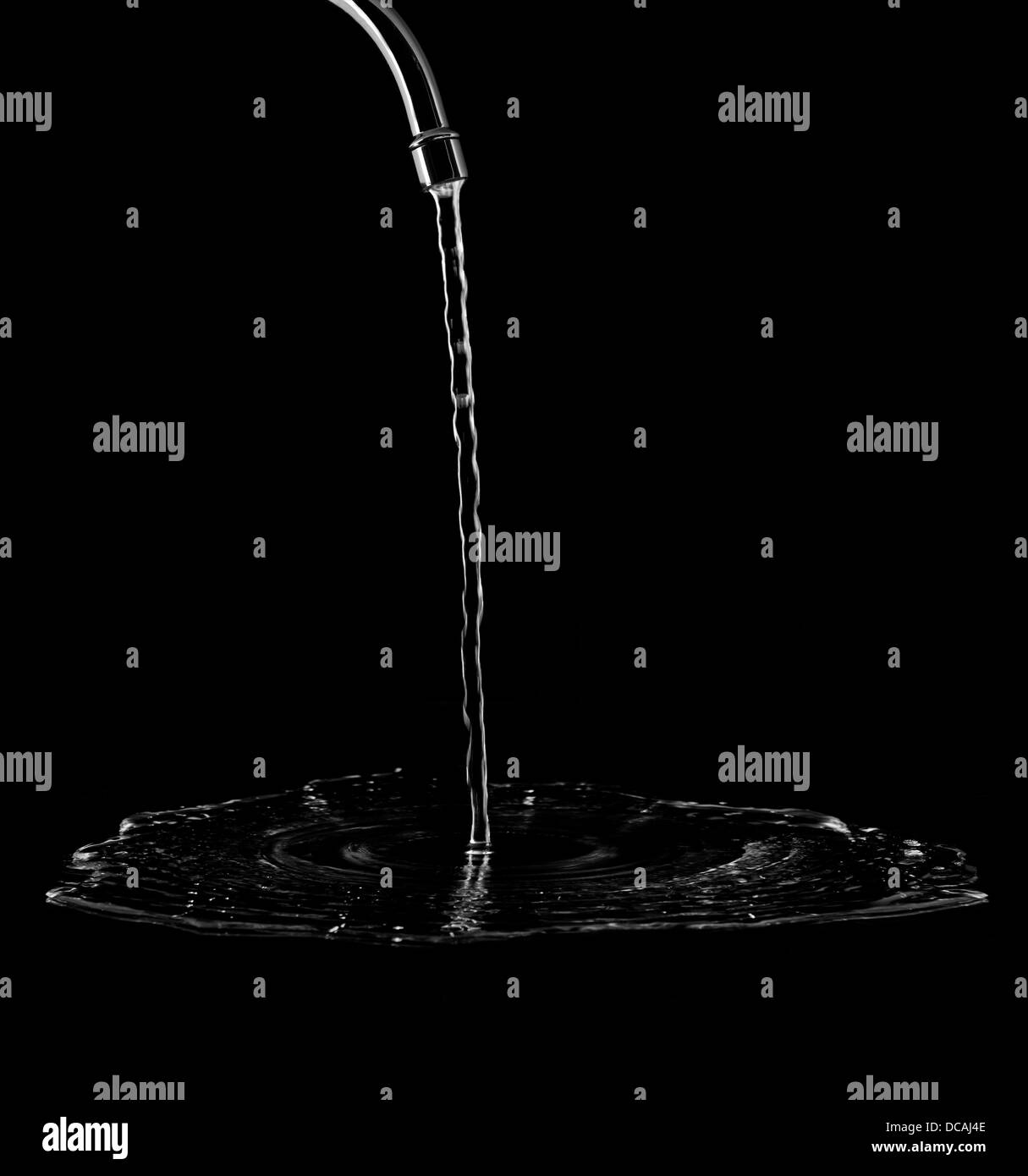 Tap with splashing water Stock Photo - Alamy