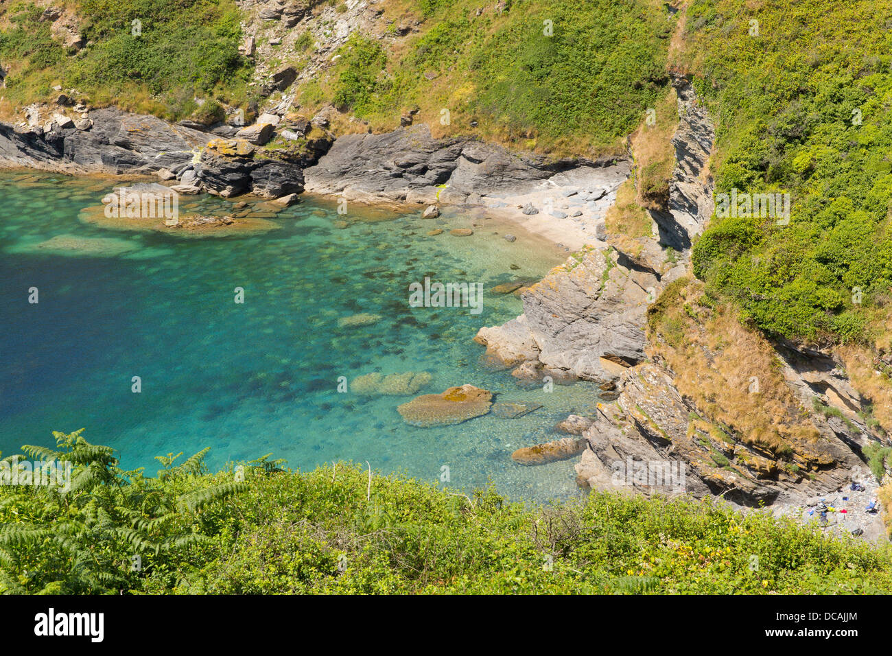 Secluded beach and cove with turquoise sea Black Head headland St ...