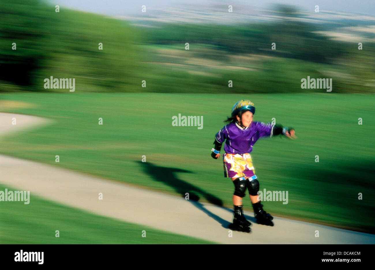 Young girl in-line skating Stock Photo - Alamy
