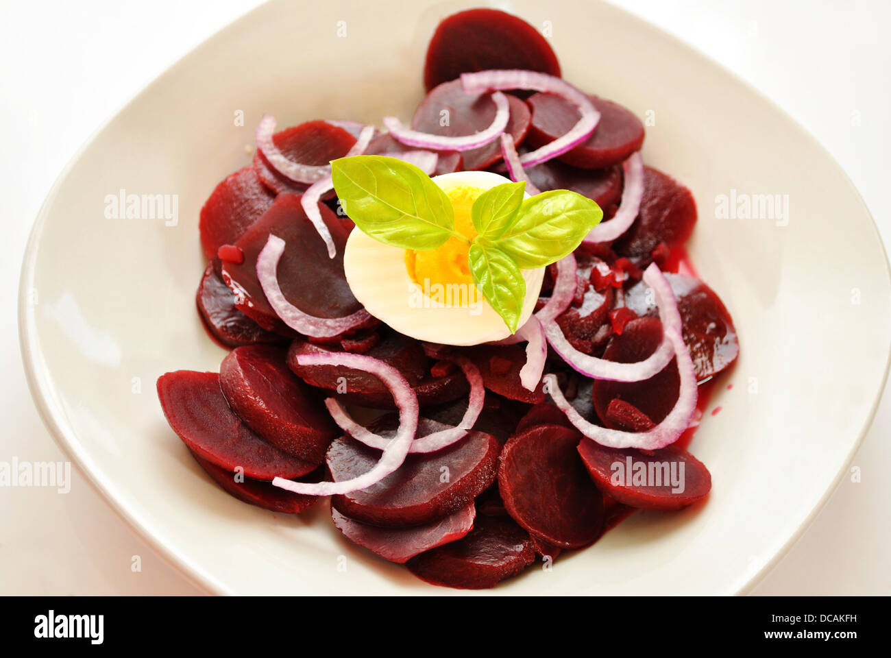 Fresh Beet Salad with Egg, Onion, and Basil Stock Photo - Alamy