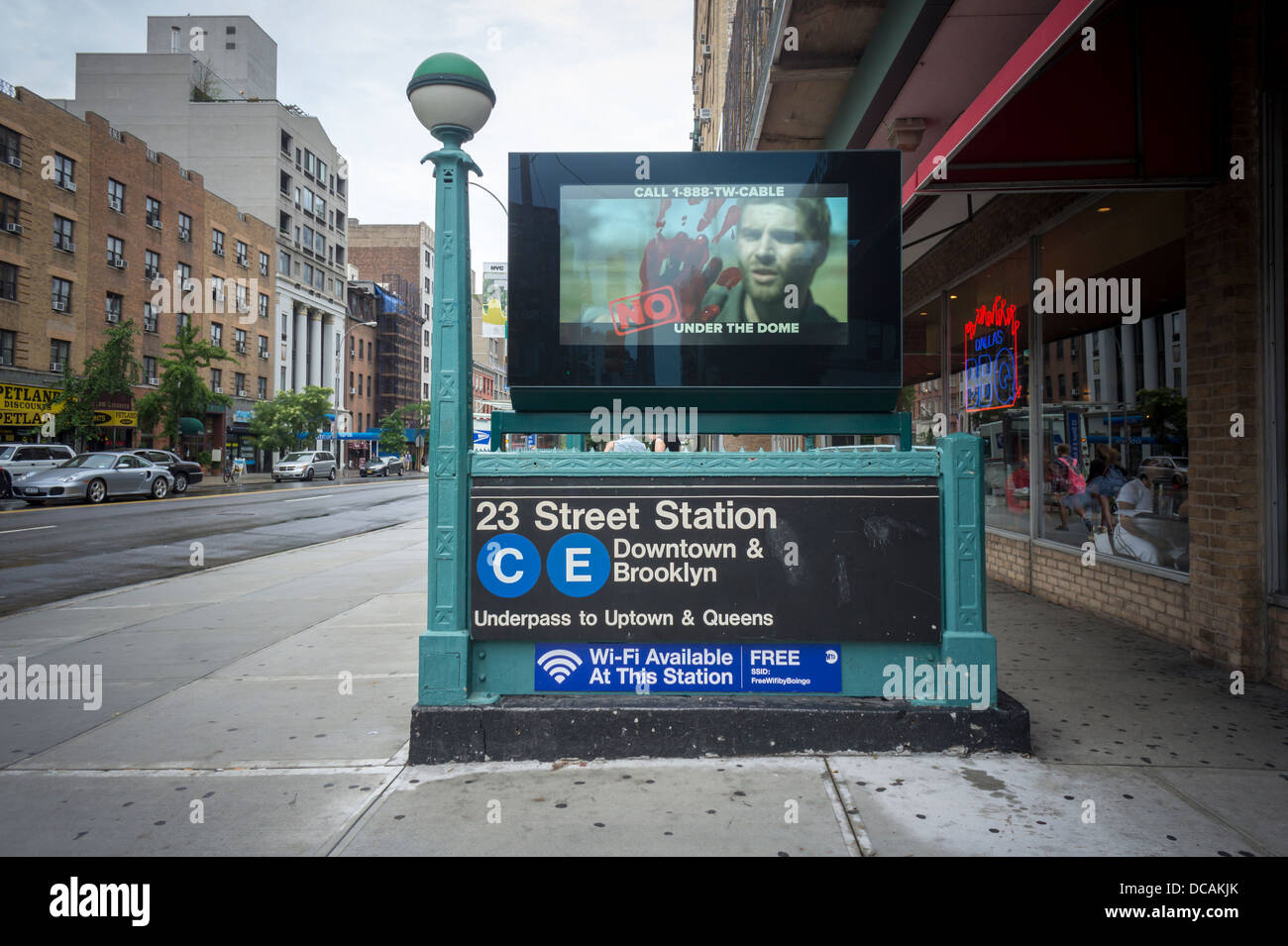 An electronic billboard on a subway entrance in New York urges ...