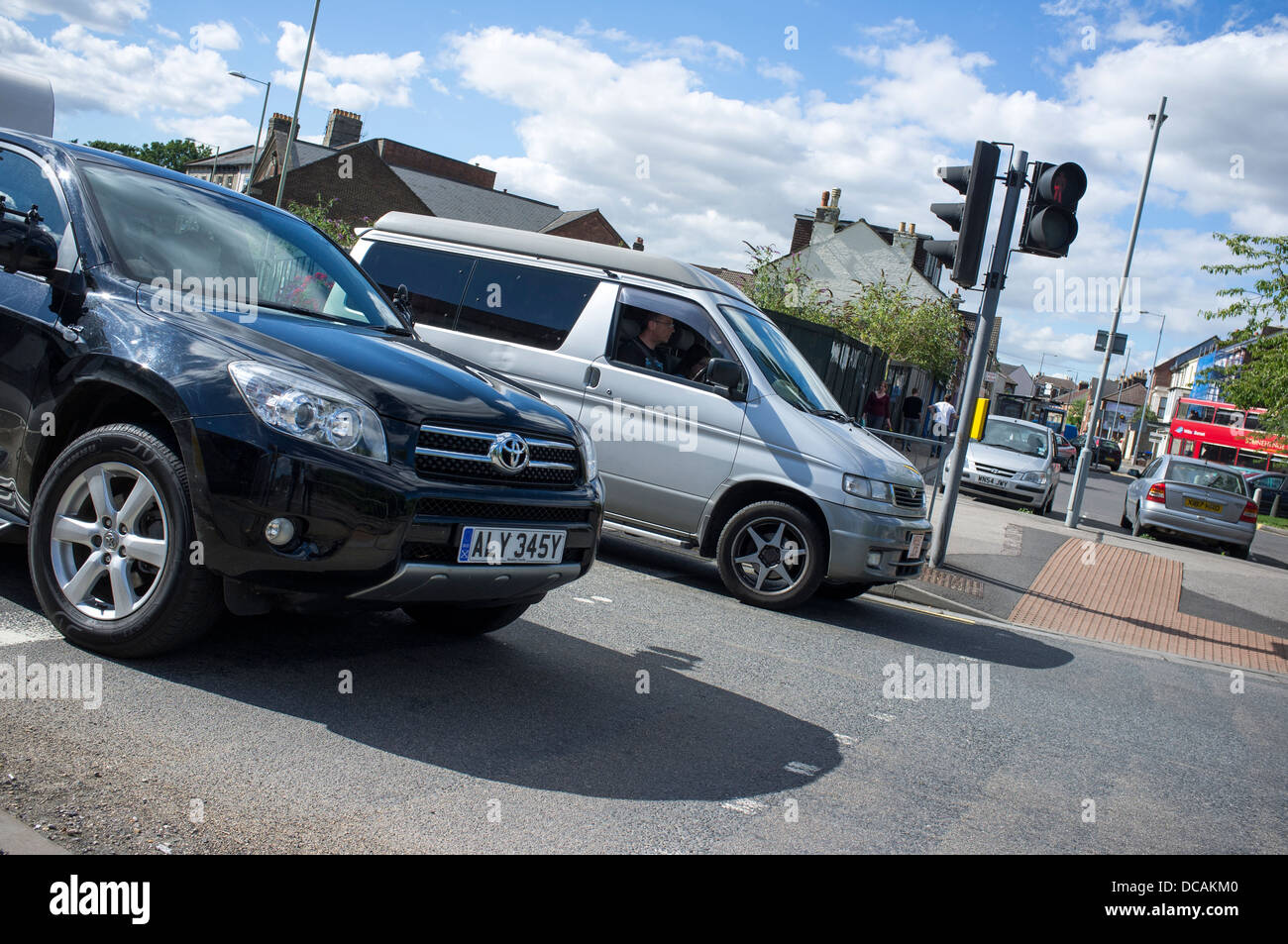 Cars at pedestrian crossing UK Stock Photo - Alamy