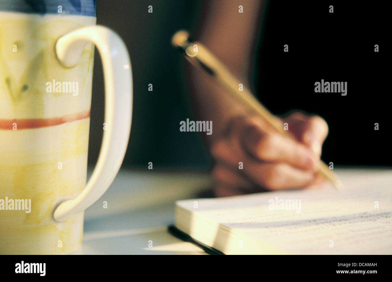 Writing in journal Stock Photo - Alamy