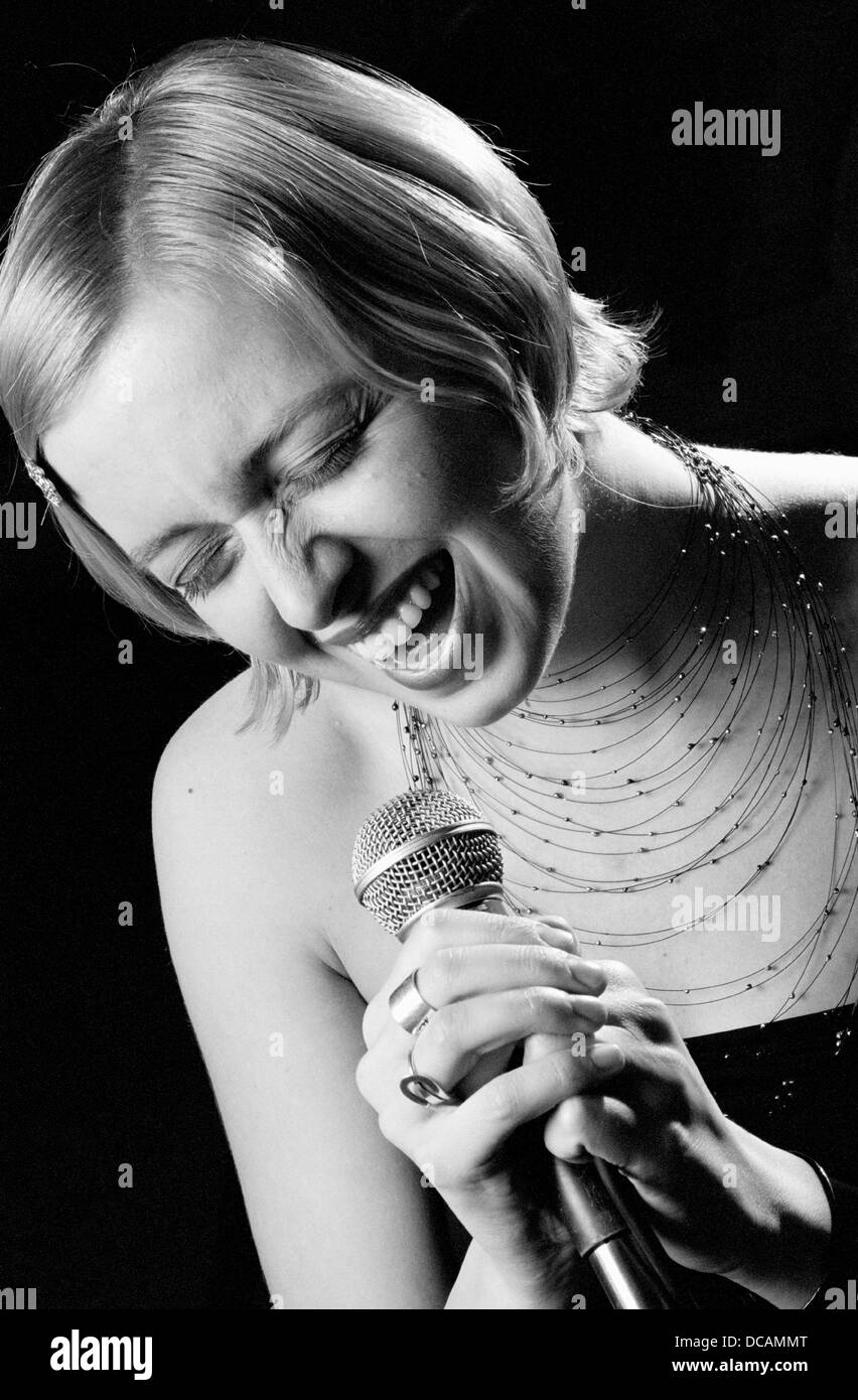 Female singer at talent show Black and White Stock Photos & Images - Alamy