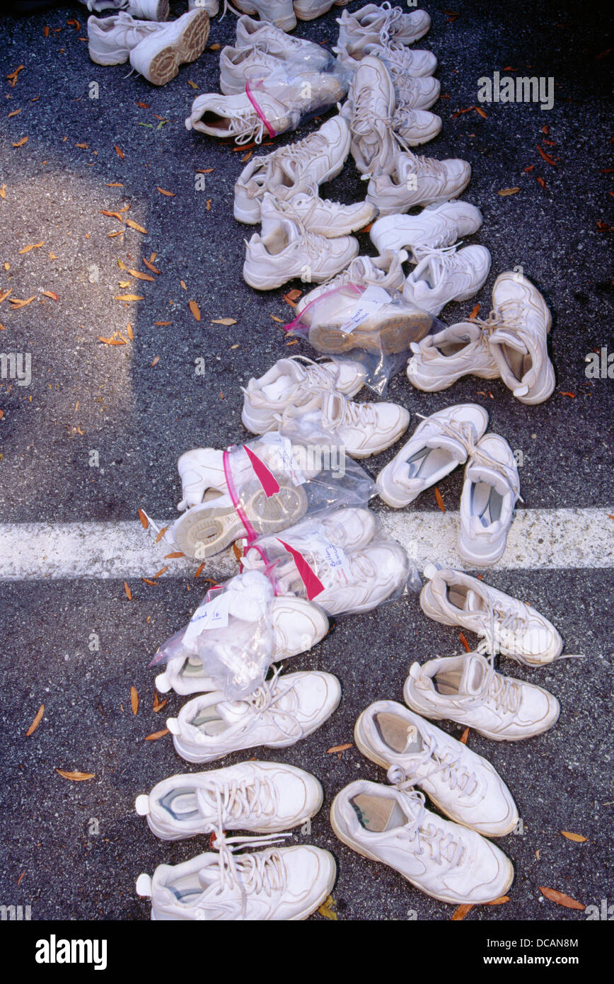White sneakers on asphalt pavement Stock Photo - Alamy