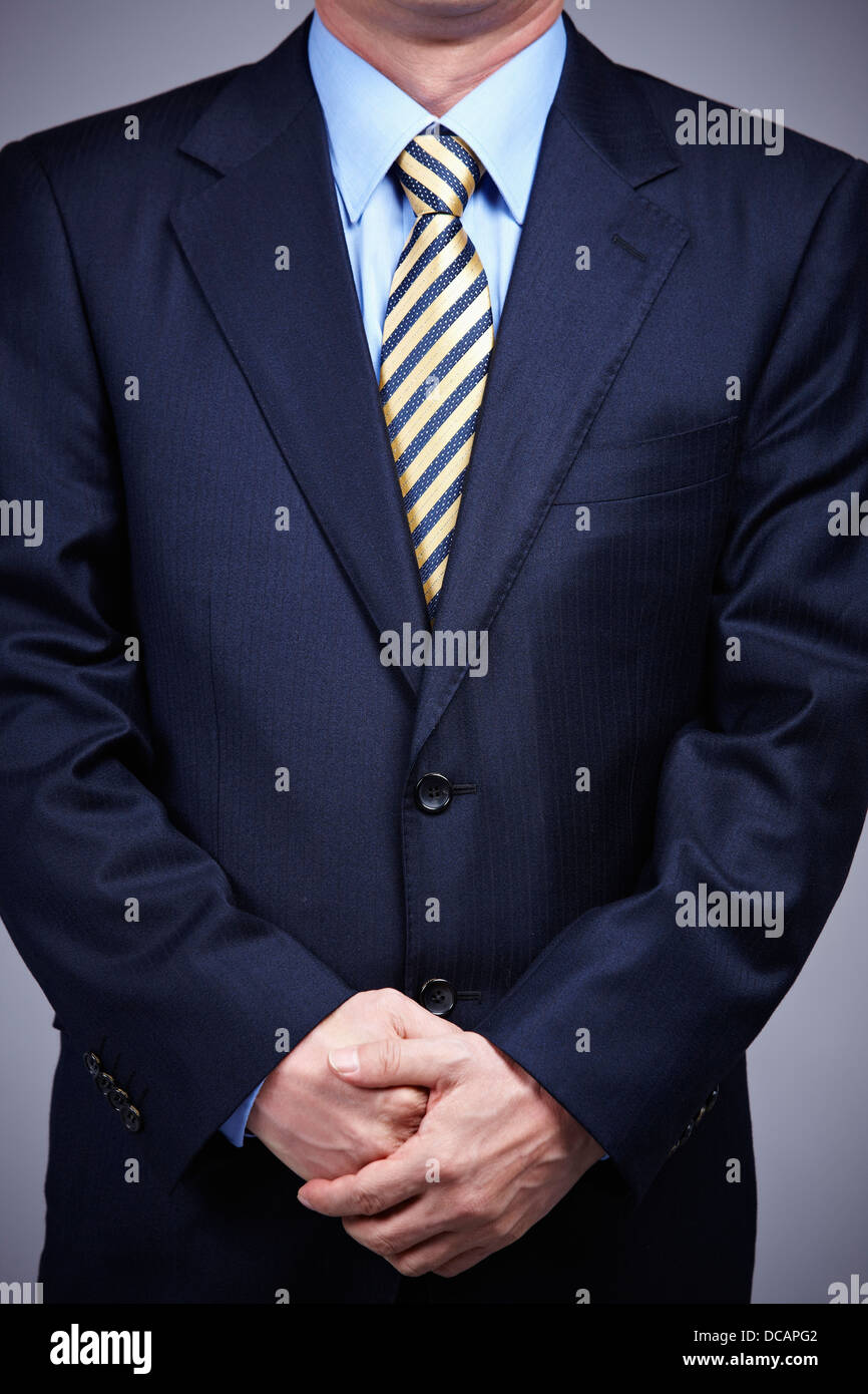a man in business suit standing neatly Stock Photo - Alamy