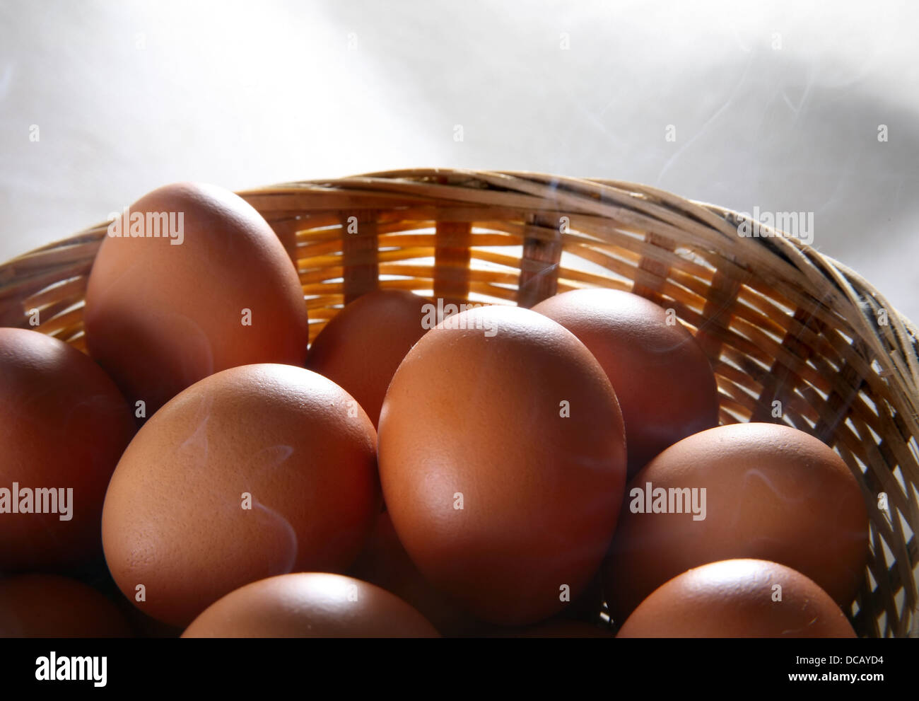 Eggs in a basket Stock Photo - Alamy
