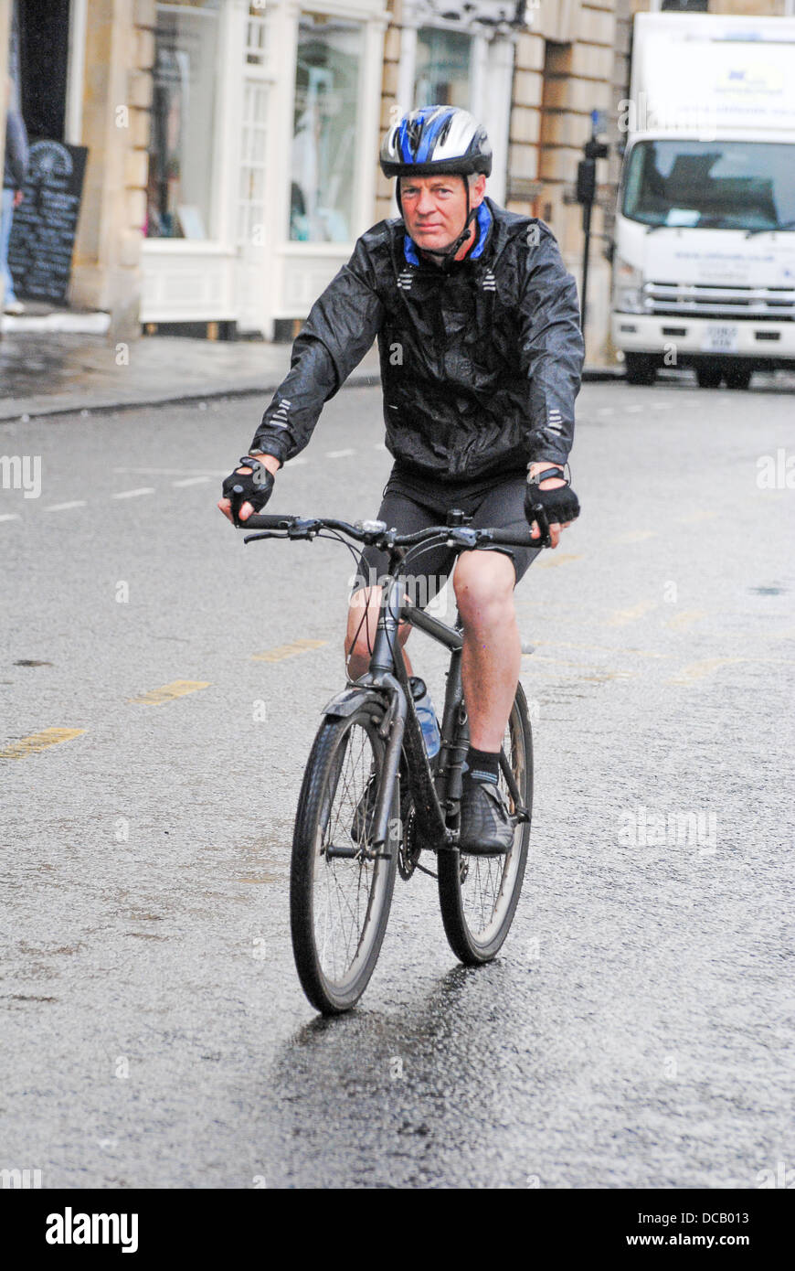 Man cycling to work Stock Photo - Alamy