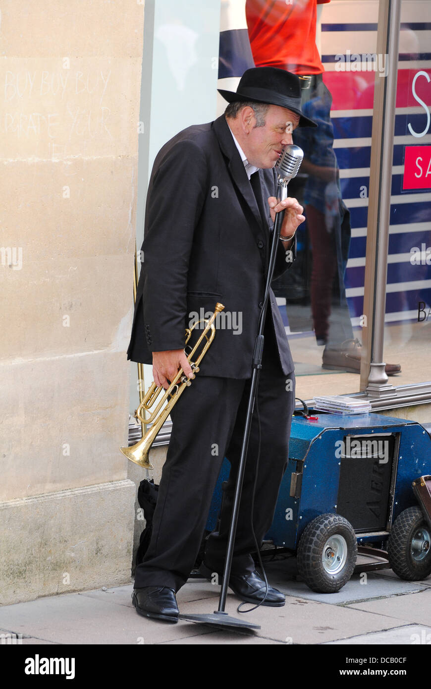 Street busker playing the trumpet and singing in Bath Somerset Stock ...
