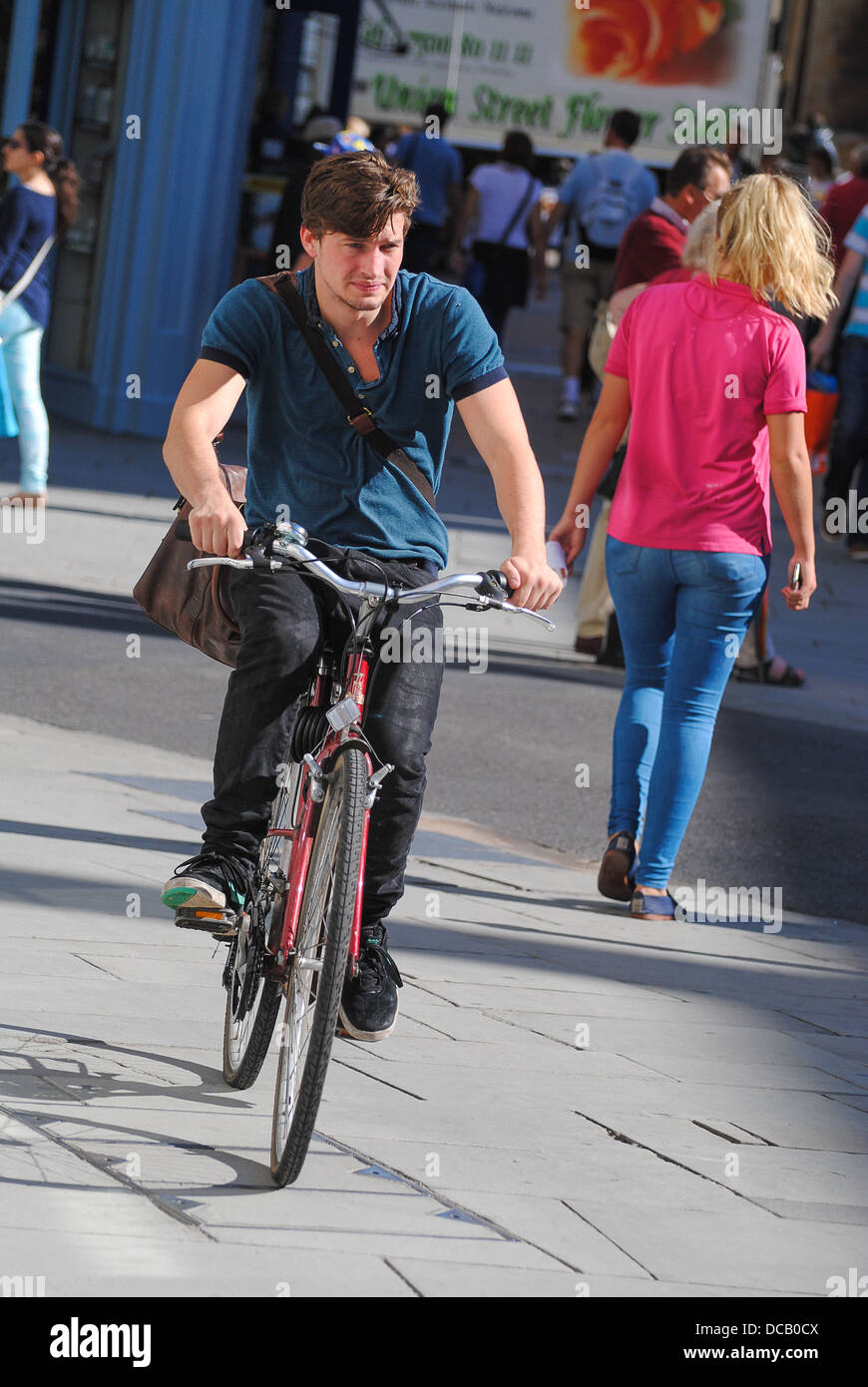 Man cycling in Bath Stock Photo - Alamy
