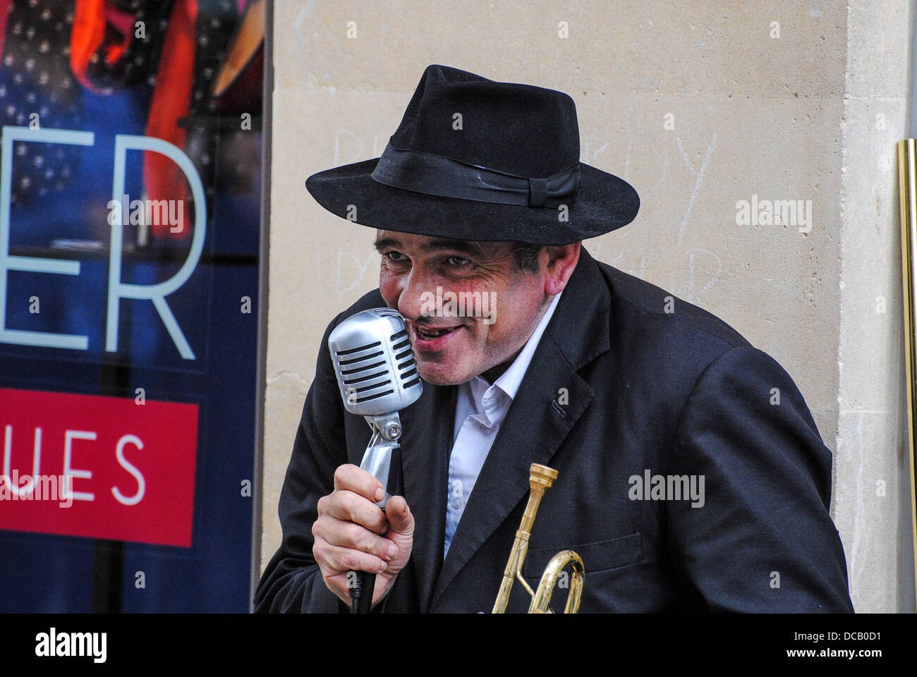 Street busker playing the trumpet and singing in Bath Somerset Stock ...