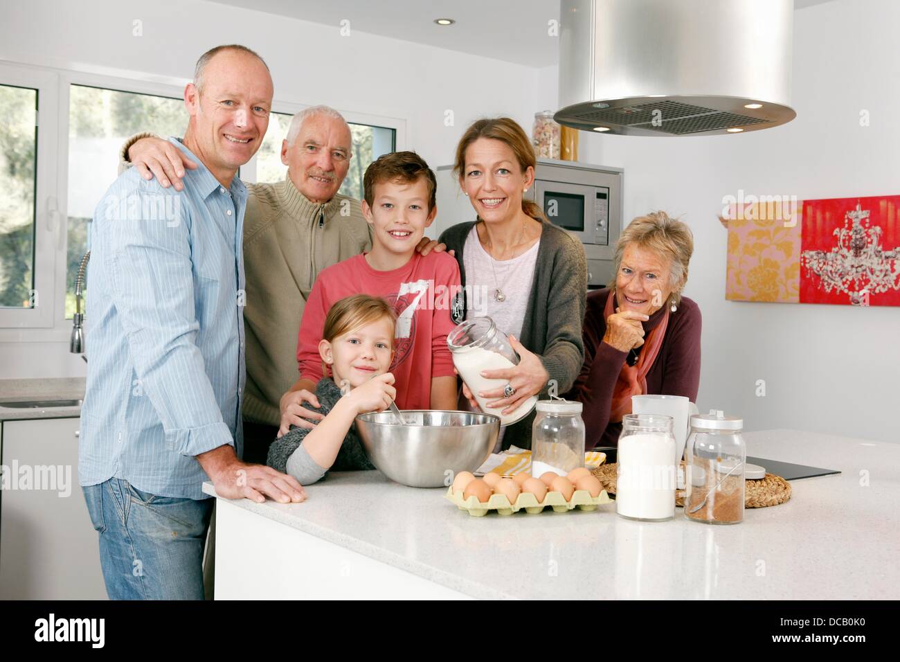 Family in the kitchen Stock Photo - Alamy