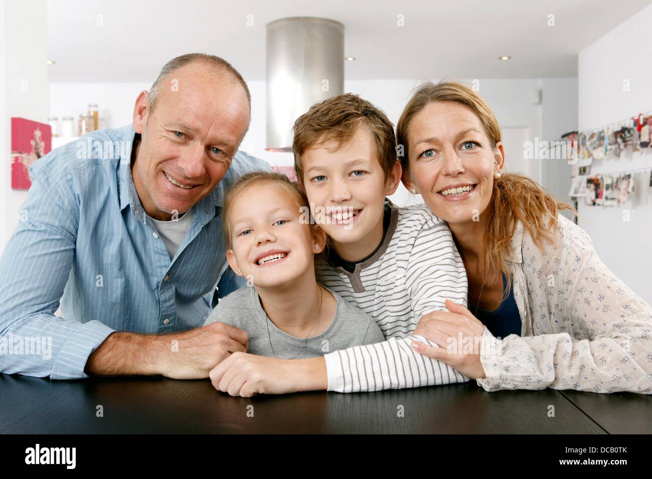Family at home Stock Photo - Alamy
