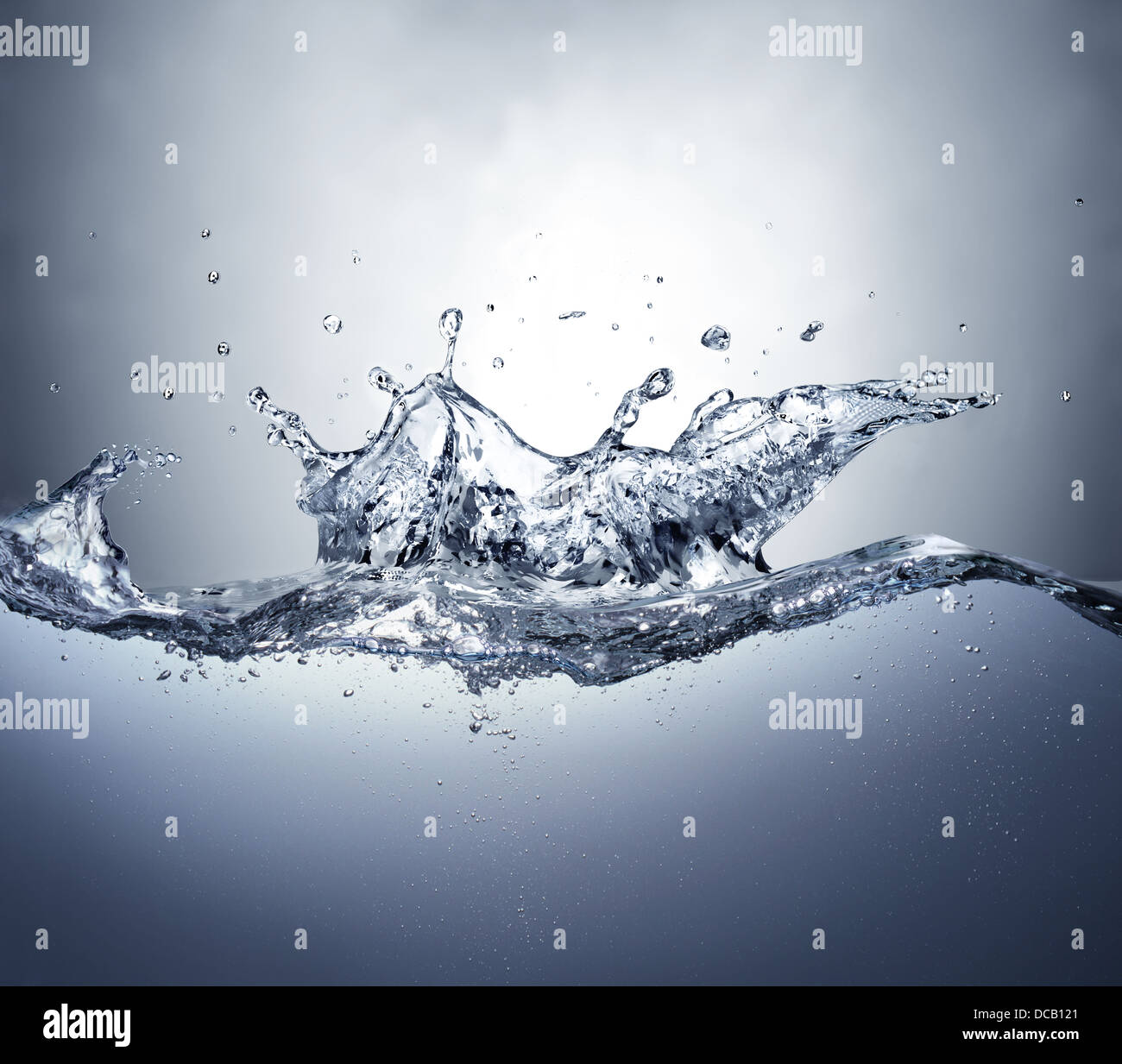 Crown splash in troubled clear water. Side view Stock Photo - Alamy