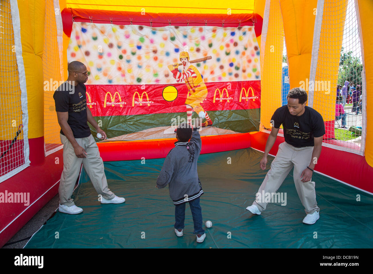 Detroit, Michigan USA. A boy throws a ball in a McDonald's booth at a ...