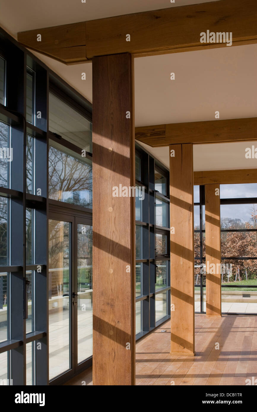 Wooden support beams and uncurtained full length windows in Castle Hill ...