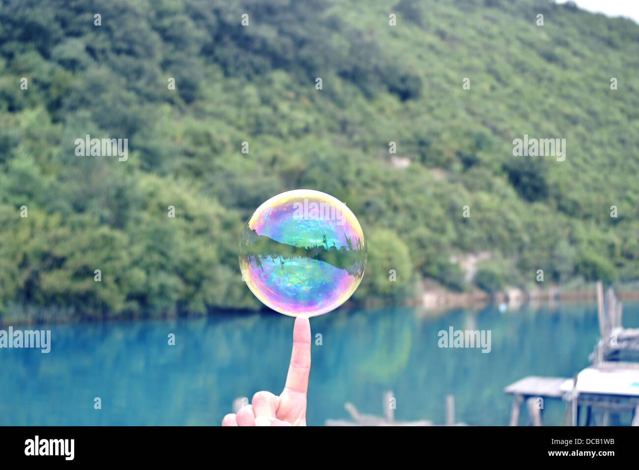 Bubble, Rainbow, human hand, finger Stock Photo - Alamy