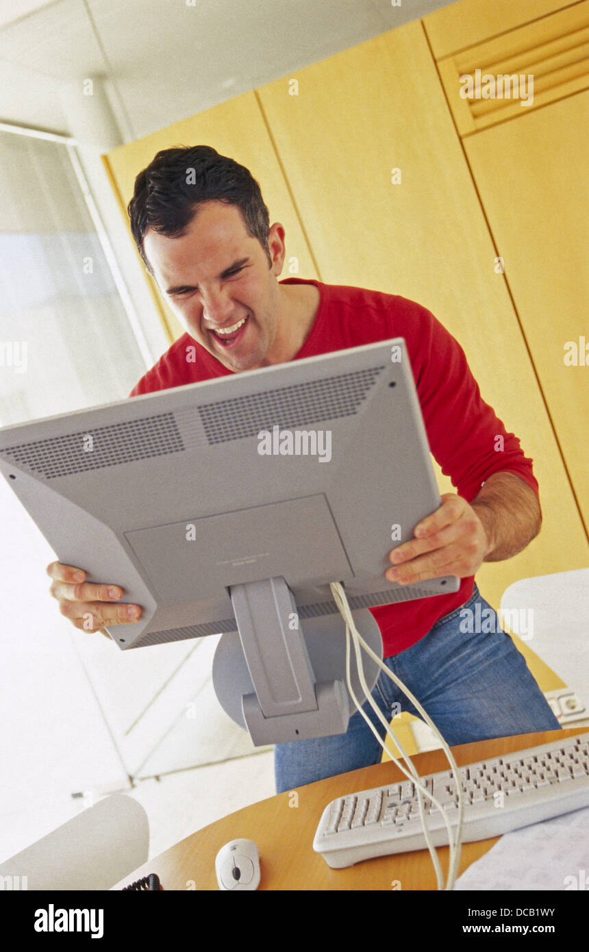 Angry man behind screen hi-res stock photography and images - Alamy