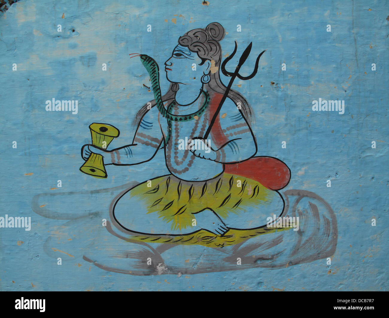 painting of the god Shiva on side of house in Varanasi backstreet india ...