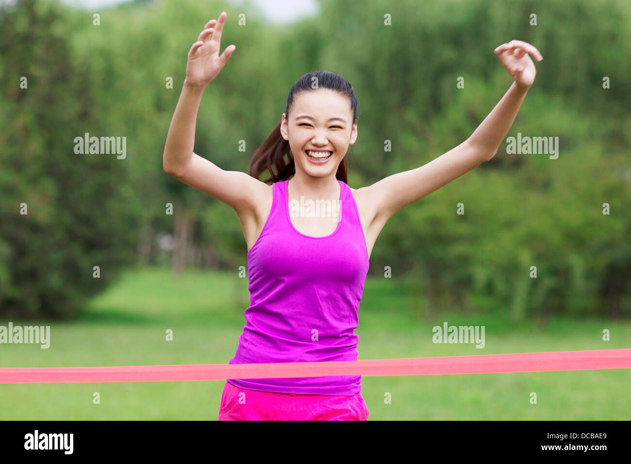 Young women to cross the finish line Stock Photo - Alamy