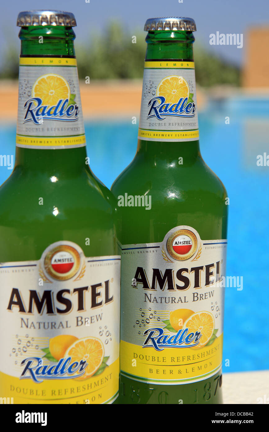 Cold bottles of Amstel Beer & Lemon outside by a swimming pool Stock ...