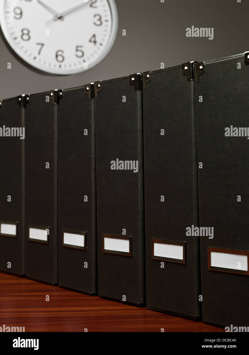 Folders and a clock Stock Photo - Alamy