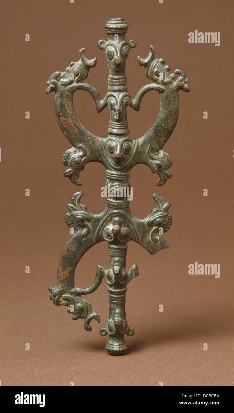 This bronze finial, designed in the shape of a 'Master of Animals ...