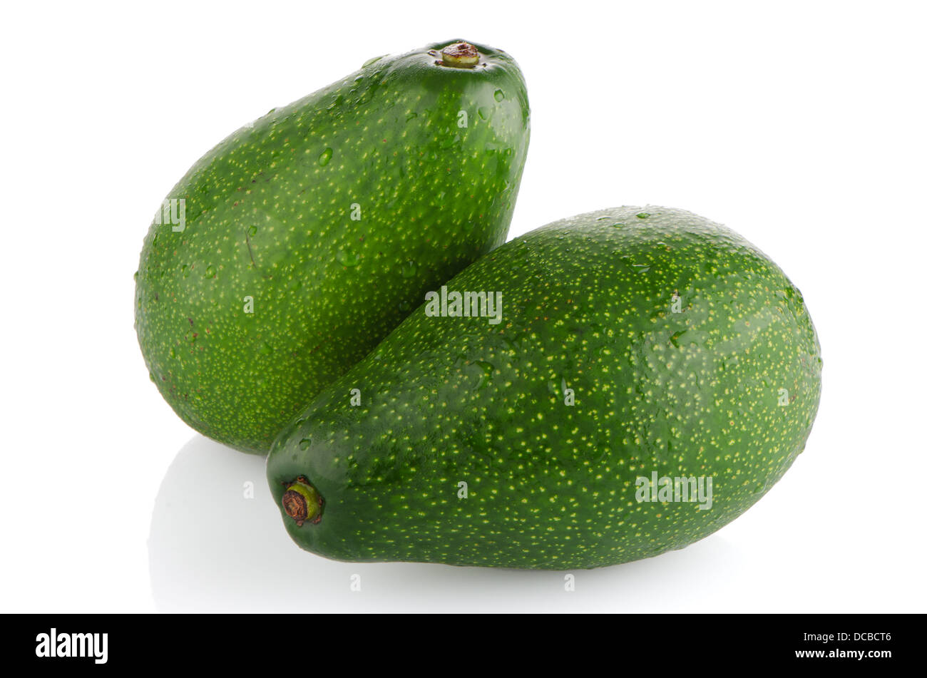 Avocado fruits on white background Stock Photo - Alamy