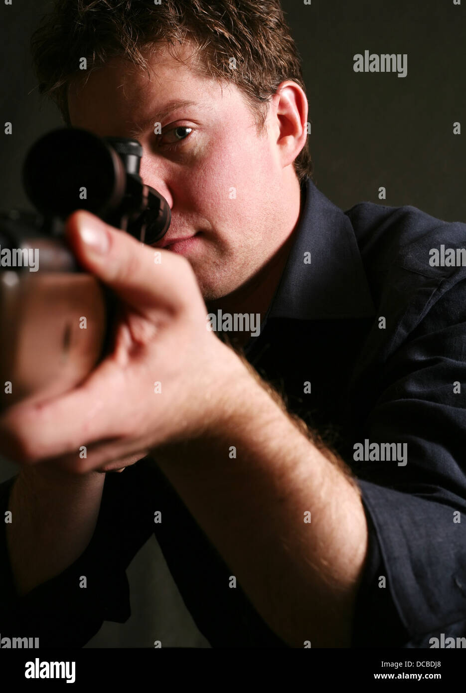 Man with a gun Stock Photo - Alamy