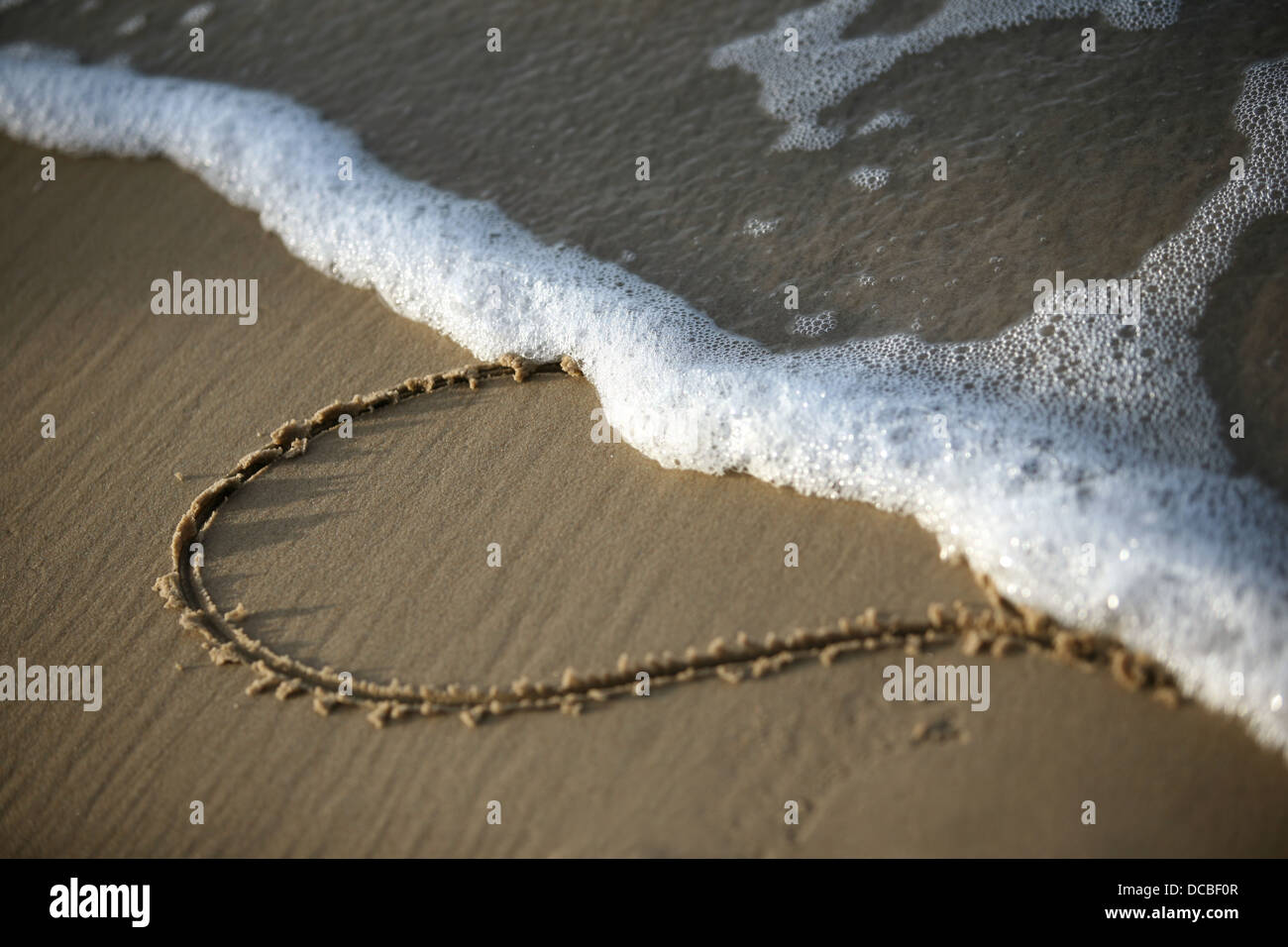 Heart on sand Stock Photo - Alamy