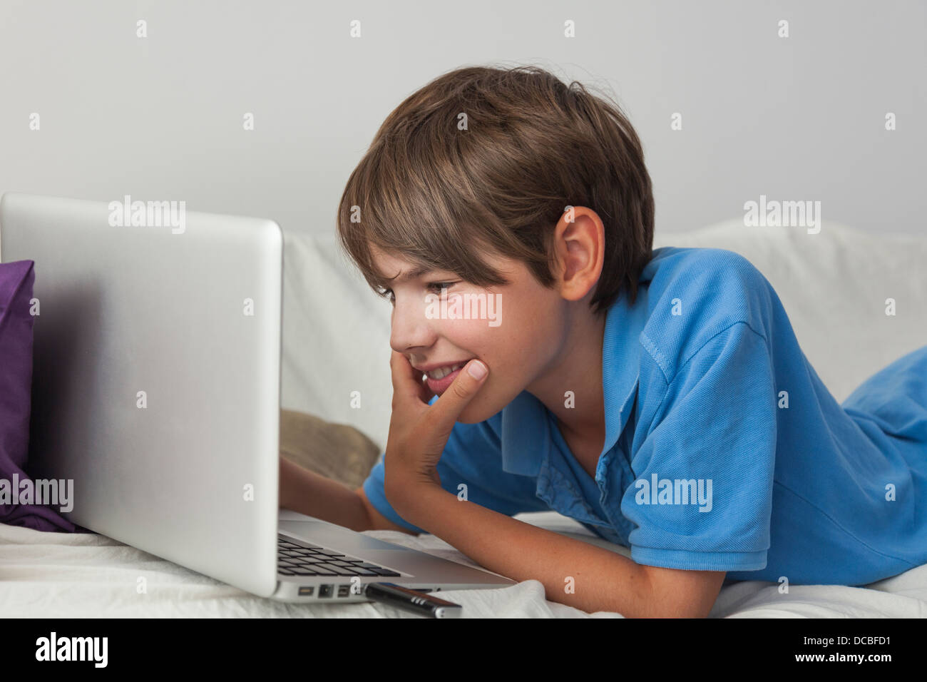 Boy chatting with friends on line on laptop at home Stock Photo - Alamy