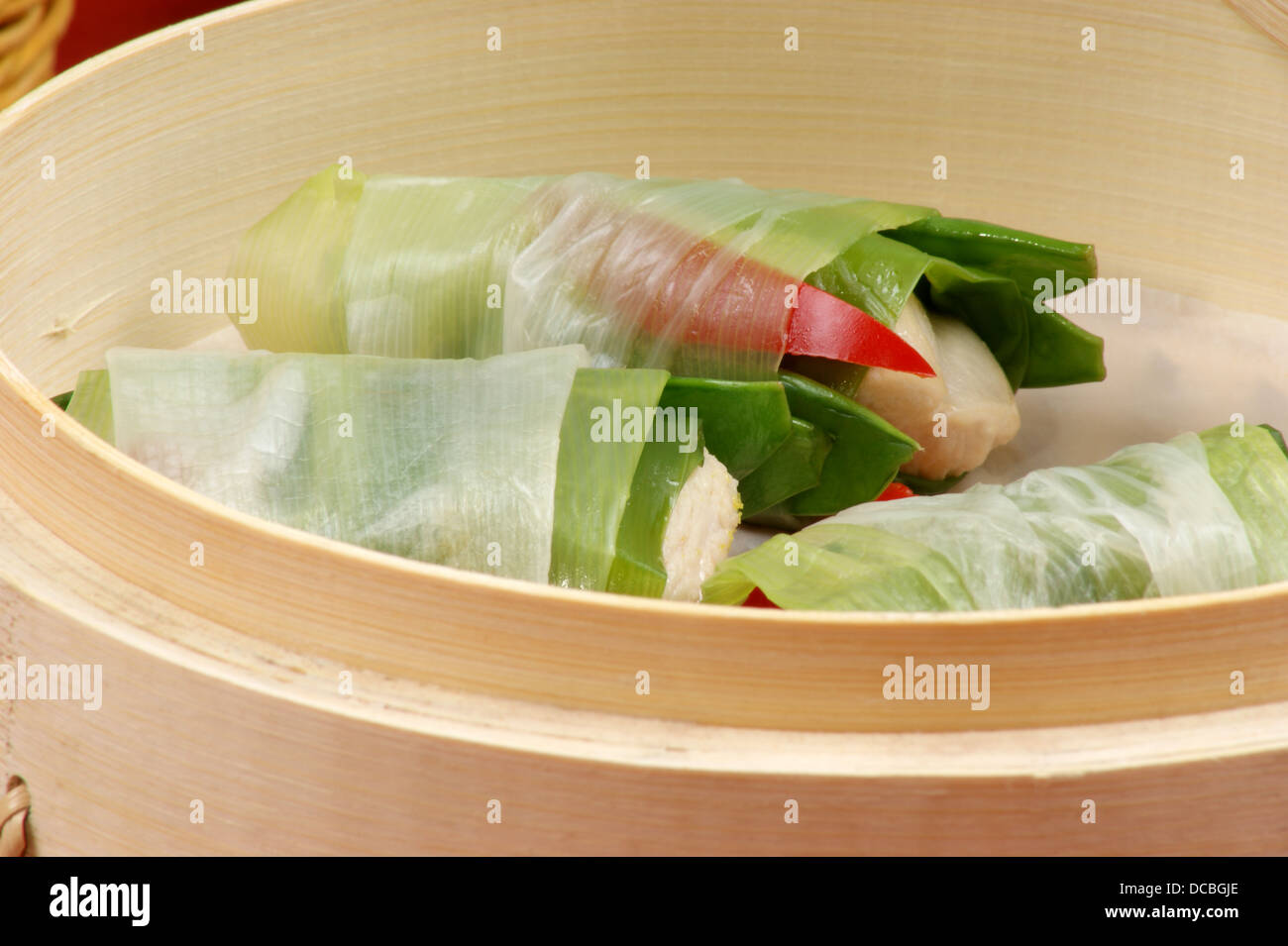 asian style chicken and vegetable bundles Stock Photo - Alamy