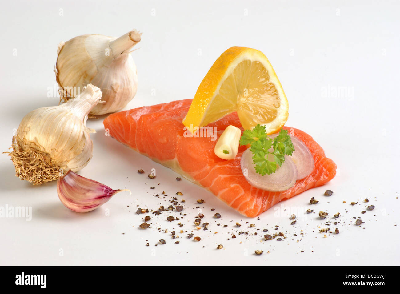 wild irish salmon fillet and lemon, pepper Stock Photo - Alamy