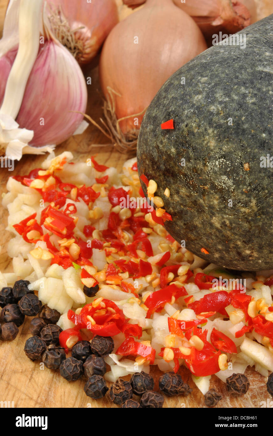 some fresh crushed organic spices and pestle Stock Photo - Alamy