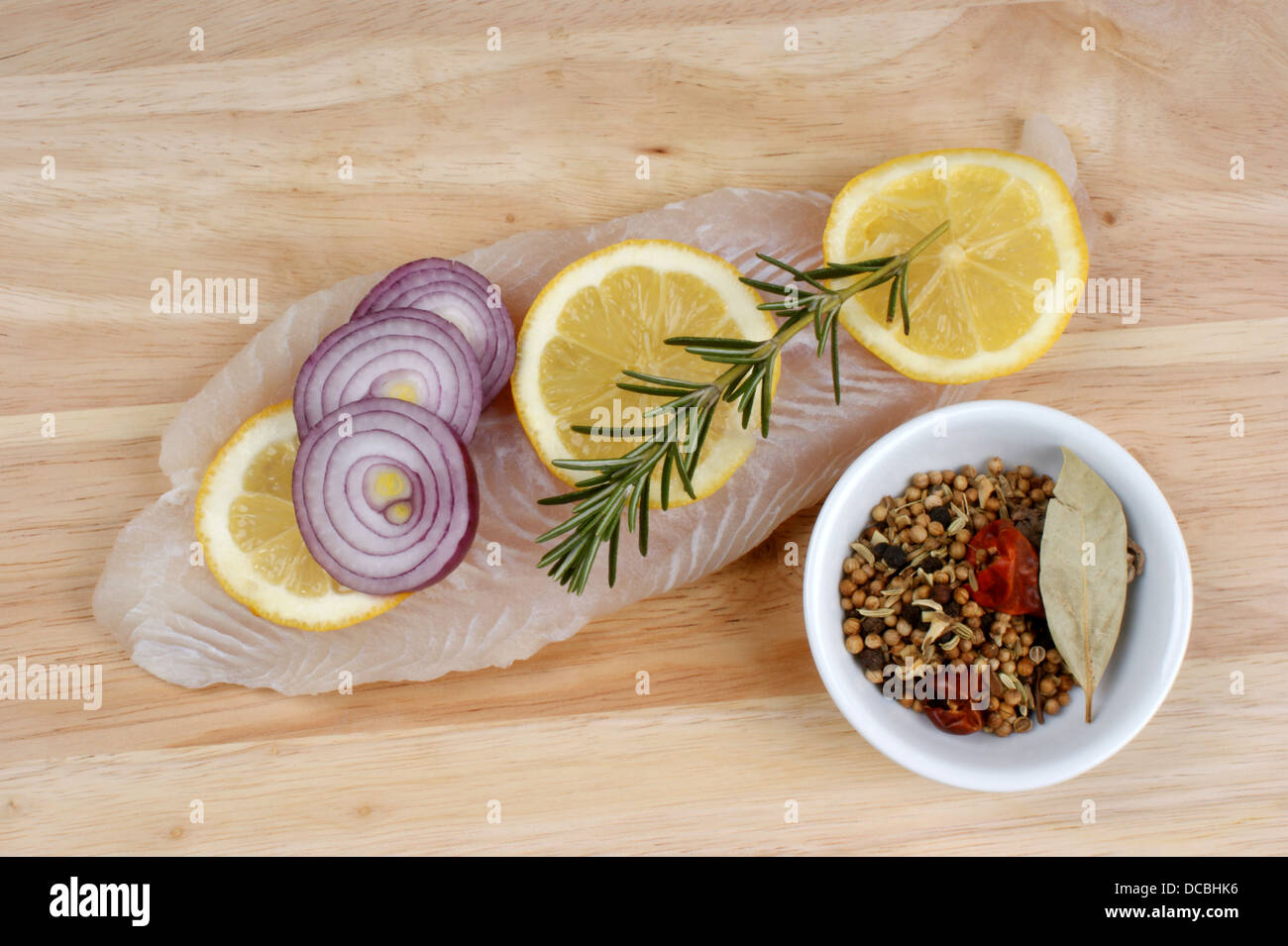 raw vietnamese river cobbler fillet on a timber board Stock Photo - Alamy