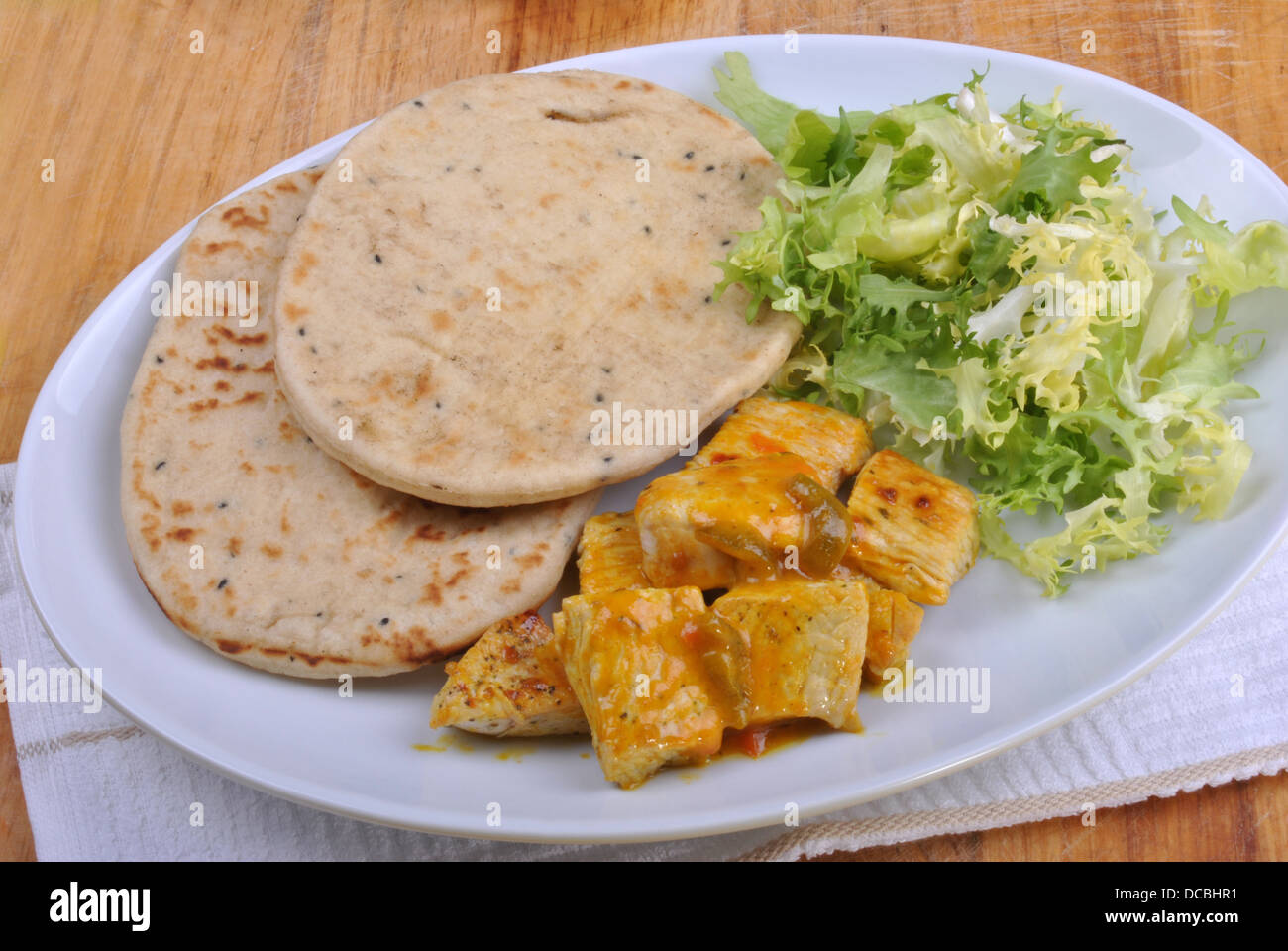 naan bread with turkey curry on a plate Stock Photo - Alamy