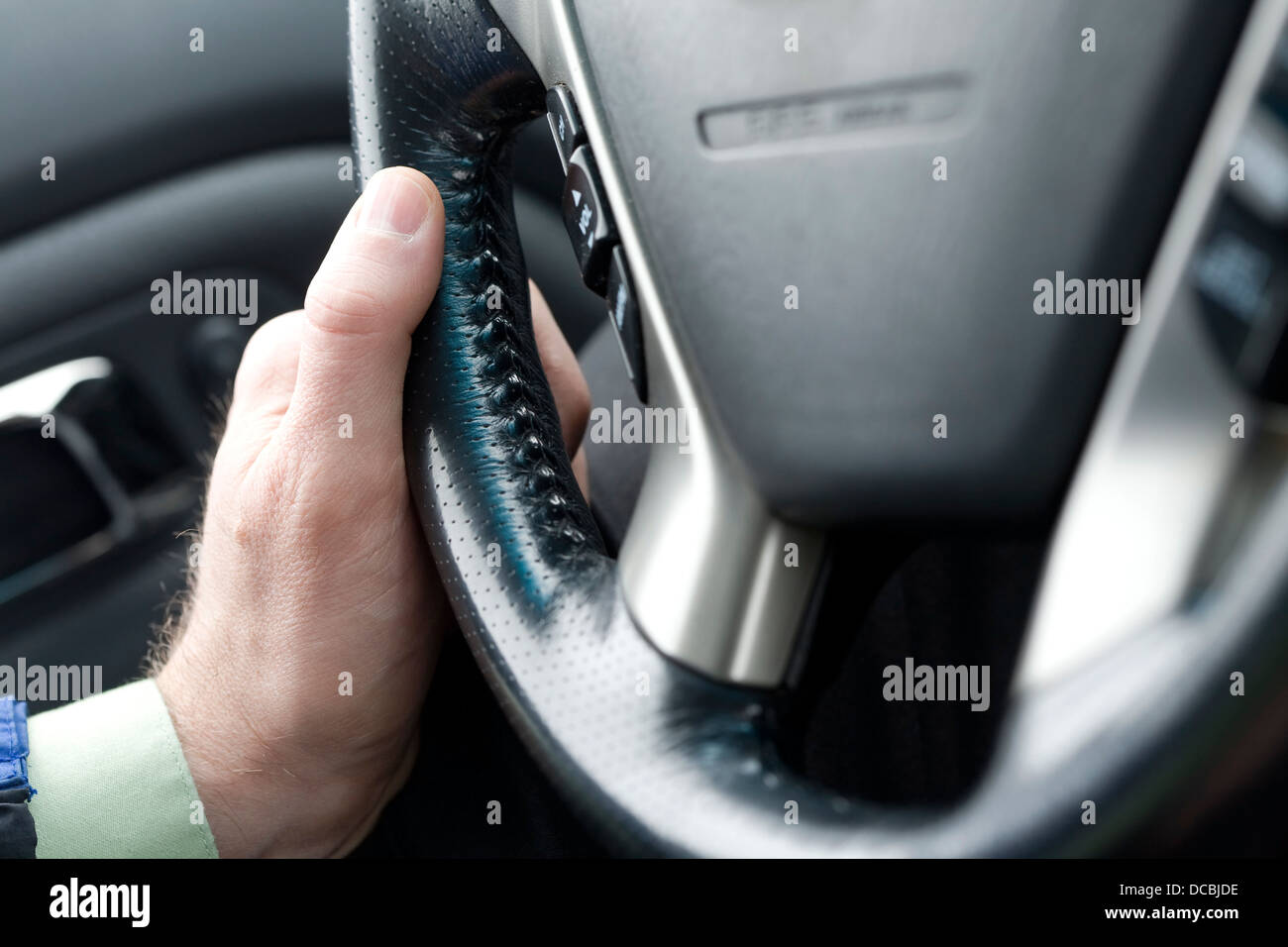 Driver's hand on wheel Stock Photo - Alamy