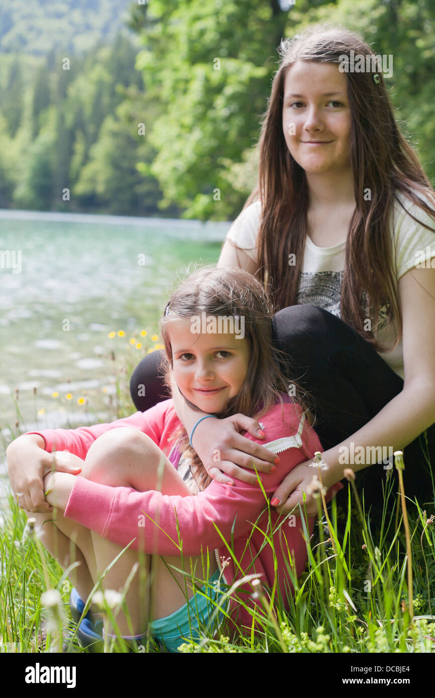 Children hugging friends hi-res stock photography and images - Alamy