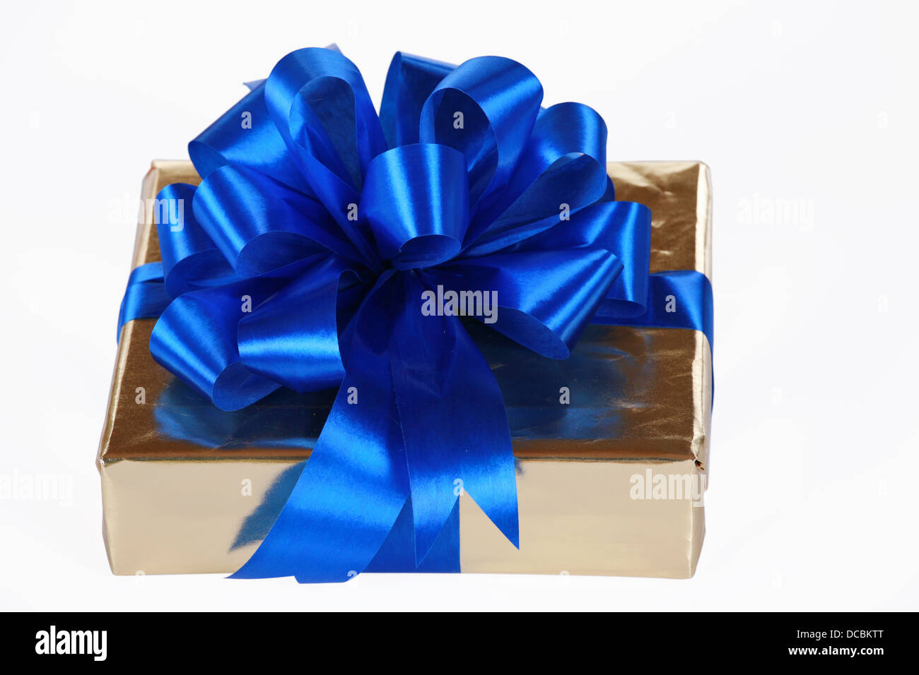 Gold present with blue ribbons Stock Photo - Alamy