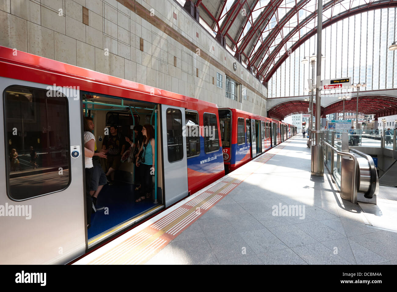 train with doors open at docklands light railway dlr canary wharf ...
