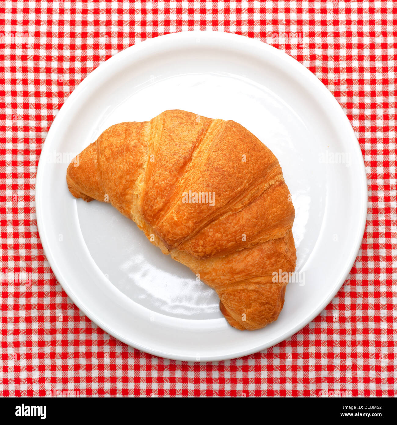 Croissant on white plate served for breakfast Stock Photo - Alamy