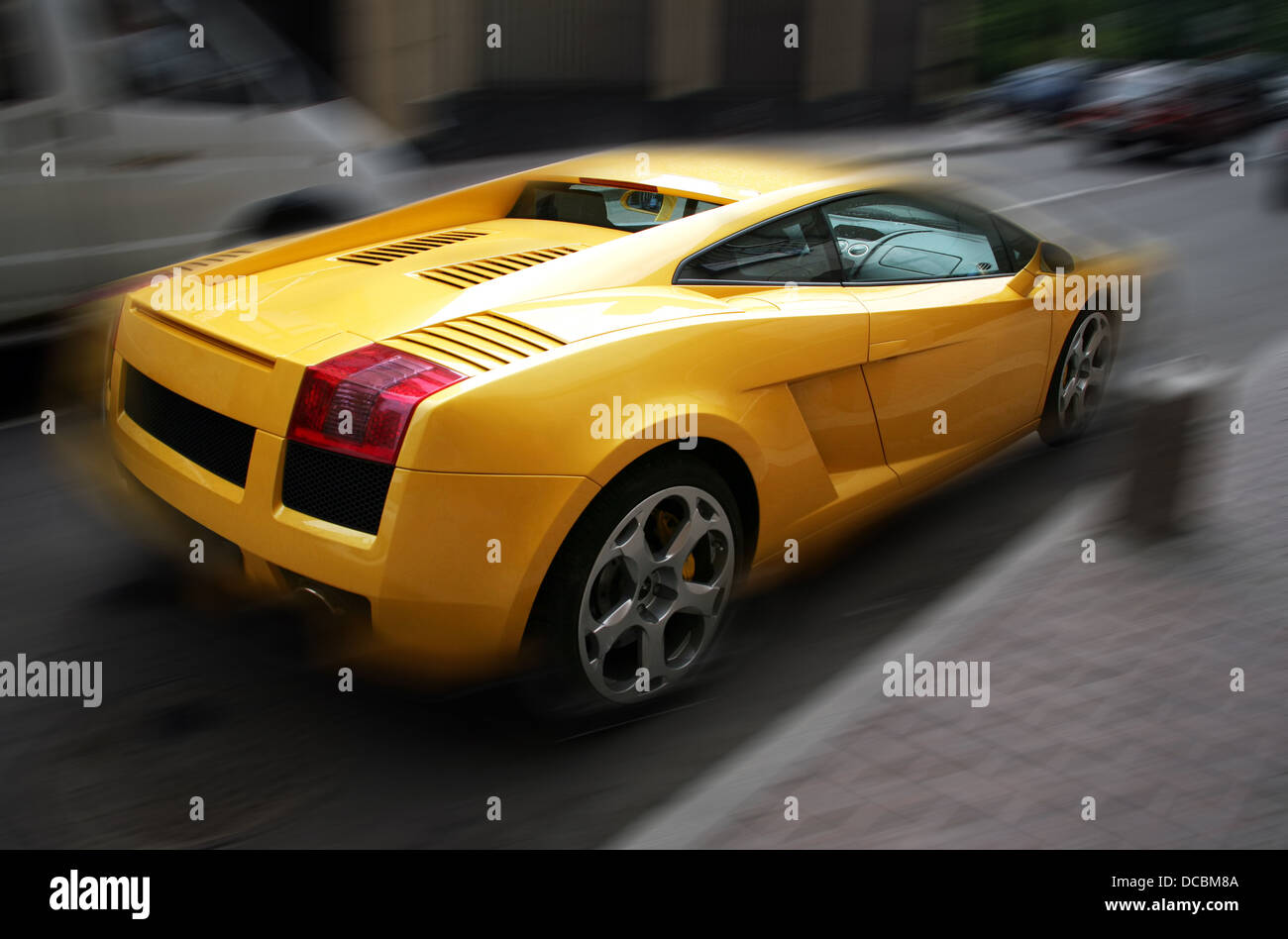 Speeding yellow race car hi-res stock photography and images - Alamy