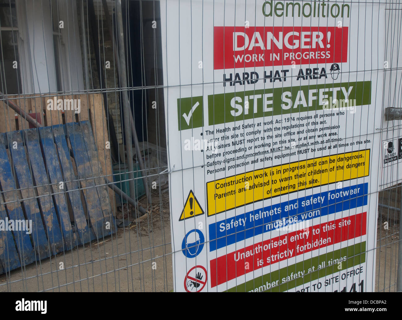 Warning sign seen on entry to a Demolition site Stock Photo - Alamy