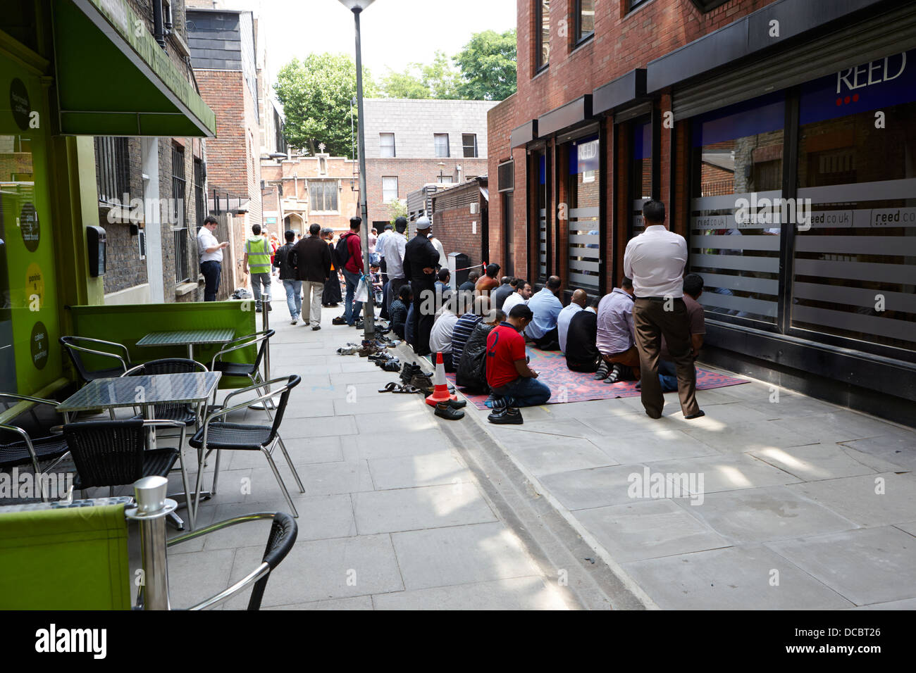 british muslims answer midday call to prayer outside mosque in central ...