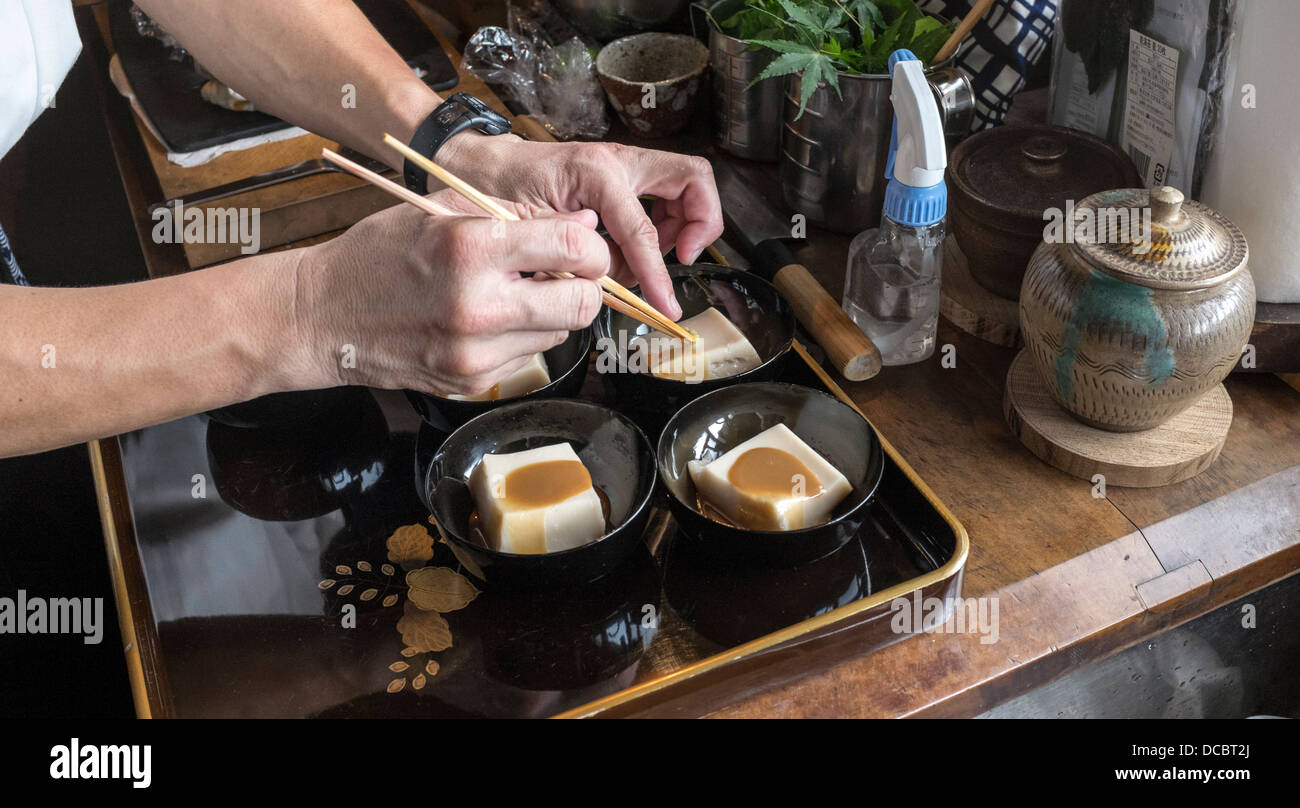 Japanese chef preparing traditional Japanese food in a traditional ...