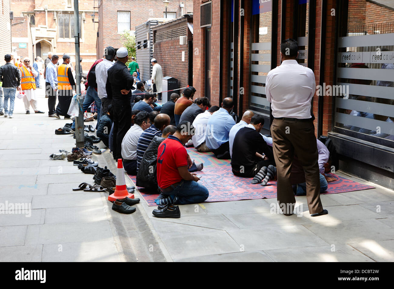 british muslims answer midday call to prayer outside mosque in central ...