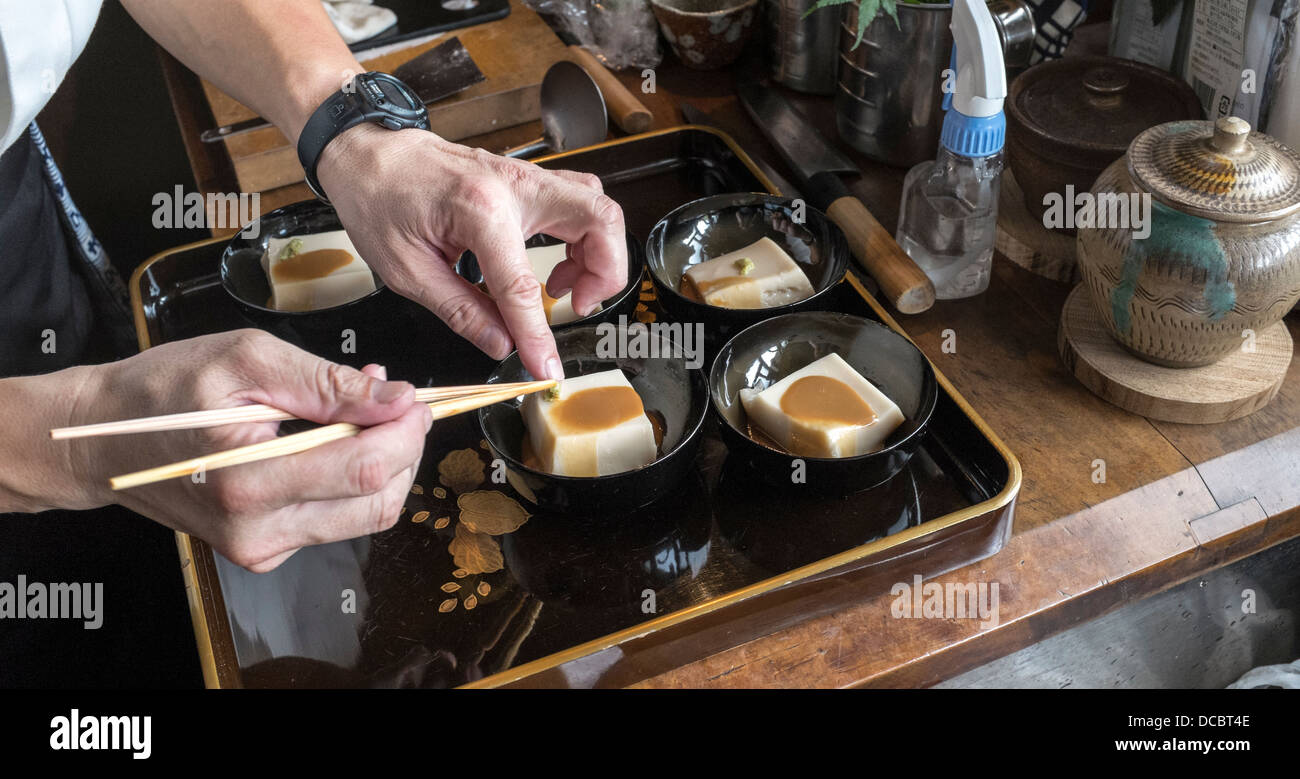 Japanese chef preparing traditional Japanese food in a traditional ...