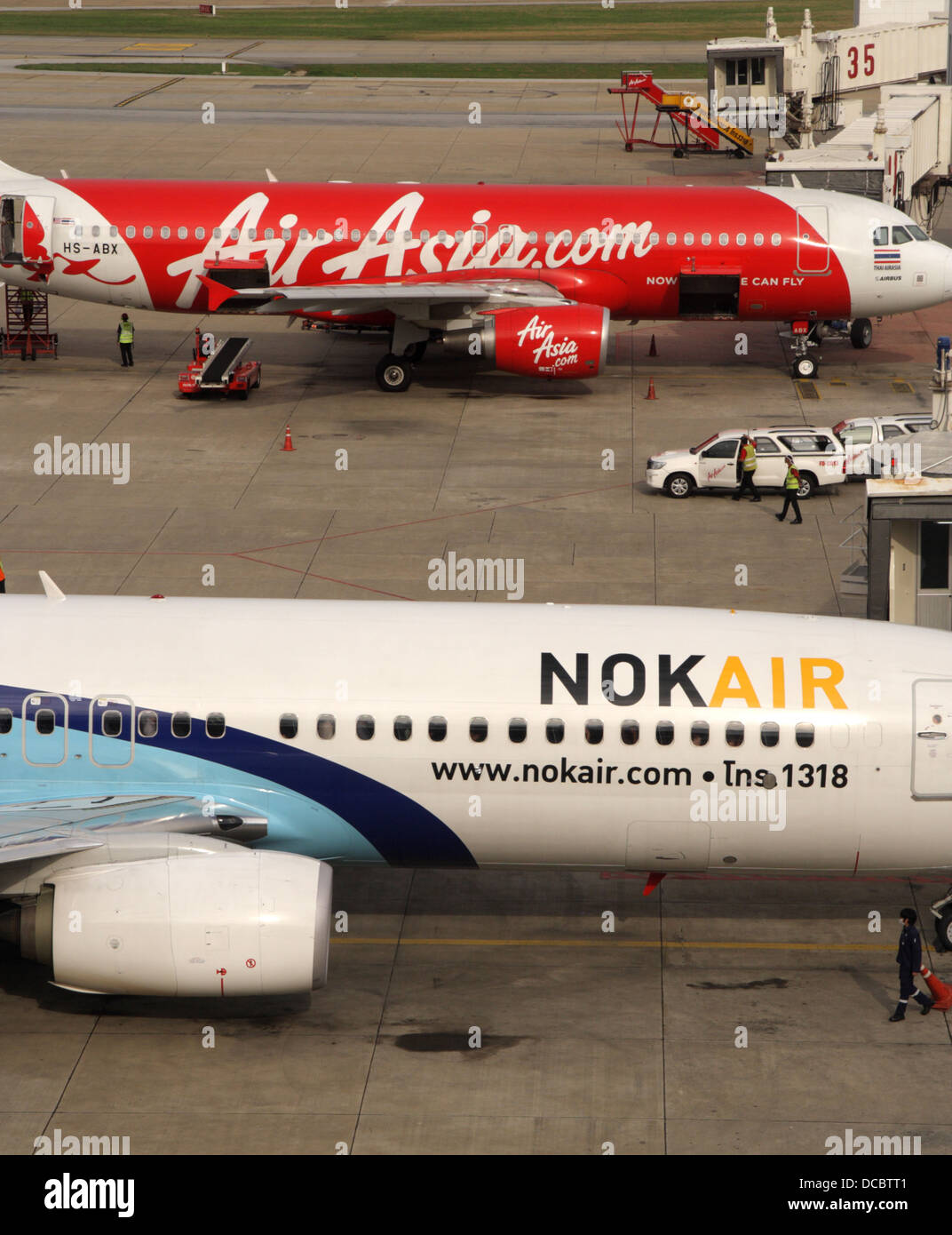 Low cost airline Nok Air parking near Air Asia plane at Don Muang ...
