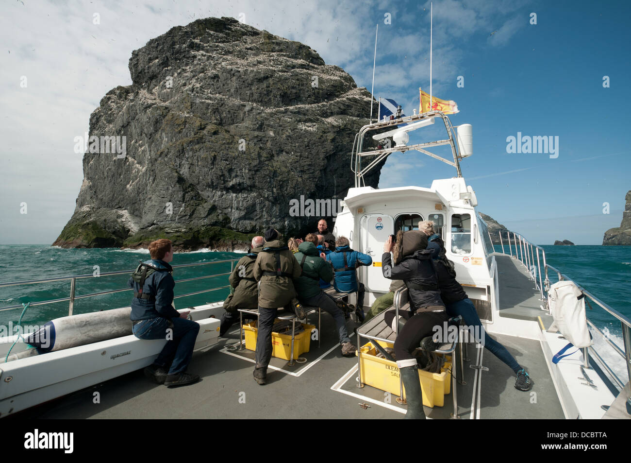 Tourist boat approaching Stac Lee, St Kilda archipelago, Outer Hebrides ...